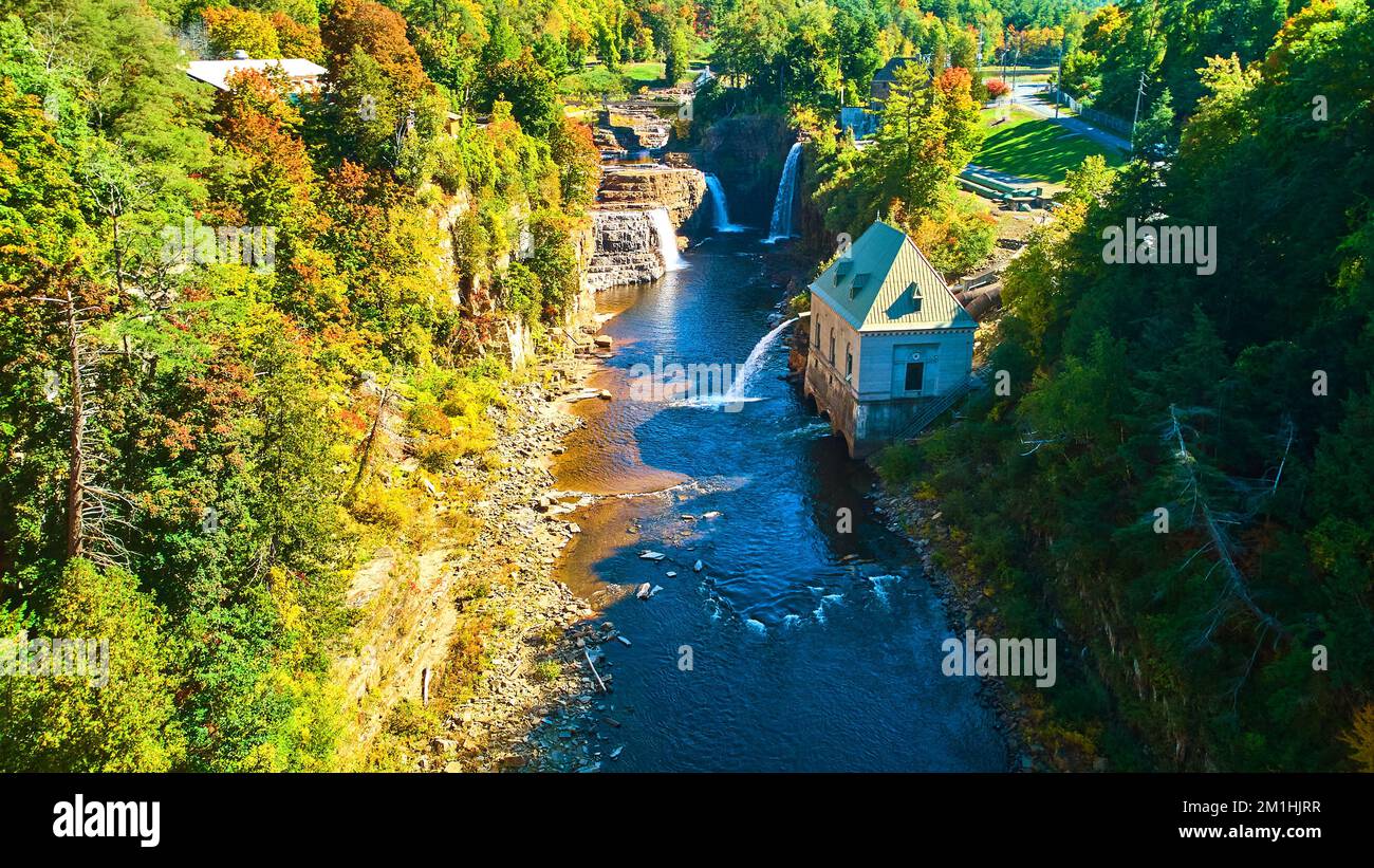 Hydroelectric power plant in canyon with huge waterfalls going over ...
