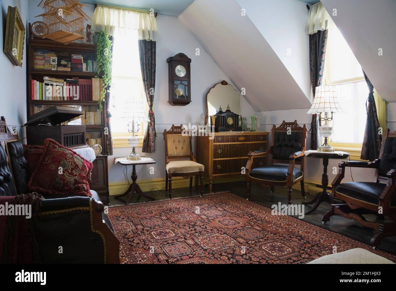 Eastlake sofa and armchairs with antique furnishings in upstairs room ...