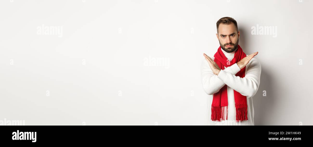 Angry bearded man frowning, showing cross stop gesture, telling no ...