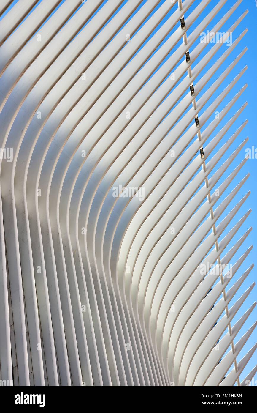 Clean abstract white spike rib architecture outside with golden light ...