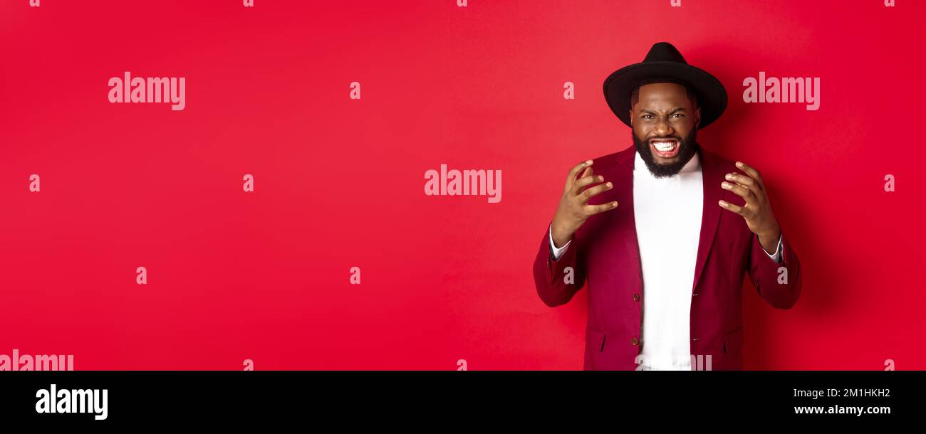 Angry african american man looking aggressive, shaking hands and ...