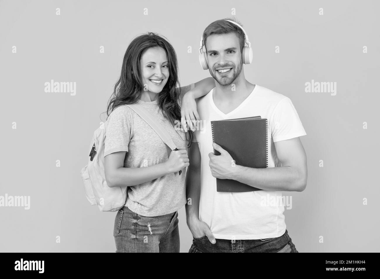knowledge day. guy and girl hold notebook. university students on ...