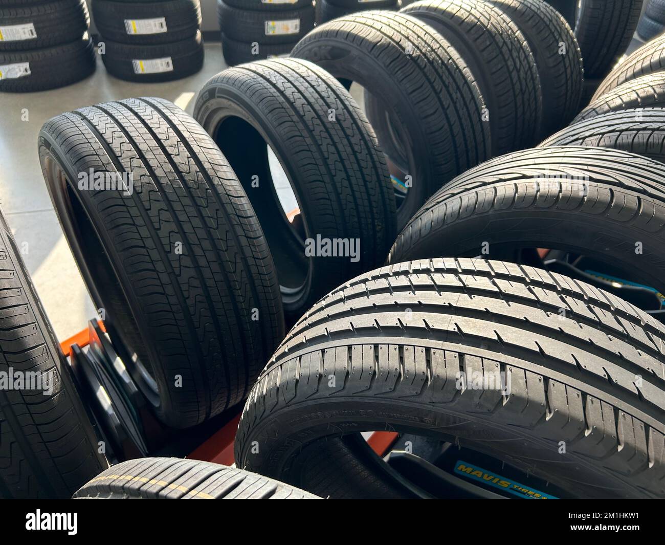 New automobile tires on display at a tire dealership Stock Photo - Alamy