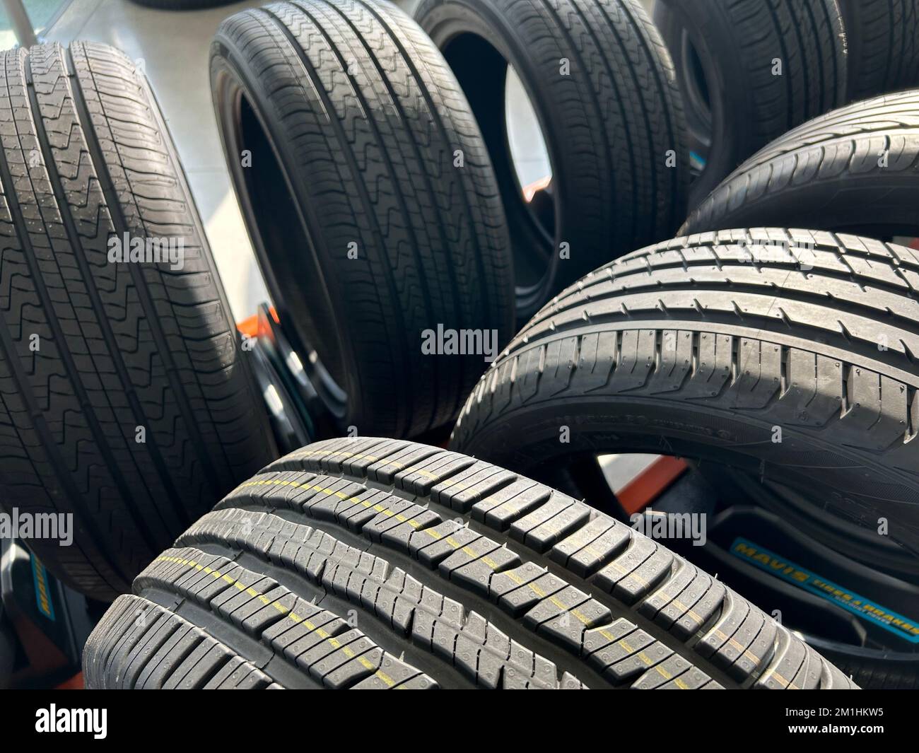 New automobile tires on display at a tire dealership Stock Photo - Alamy
