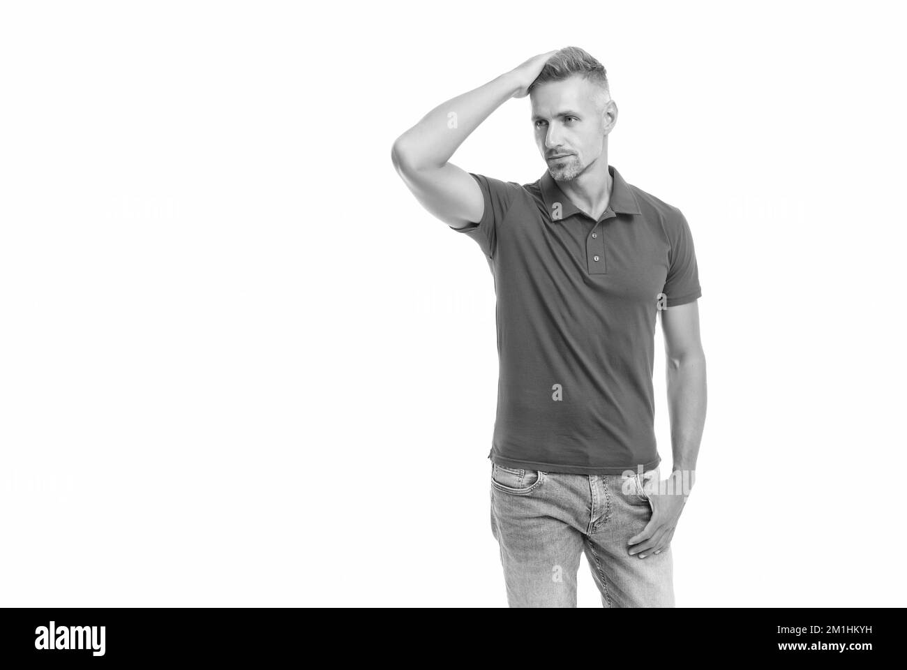 male fashion model in casual style clothes touch hair isolated on white ...