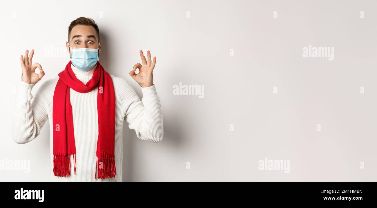 Covid-19, lockdown and quarantine concept. Impressed man in face mask ...