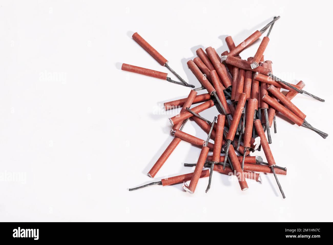 Pile of red firecrackers isolated on white background Stock Photo - Alamy