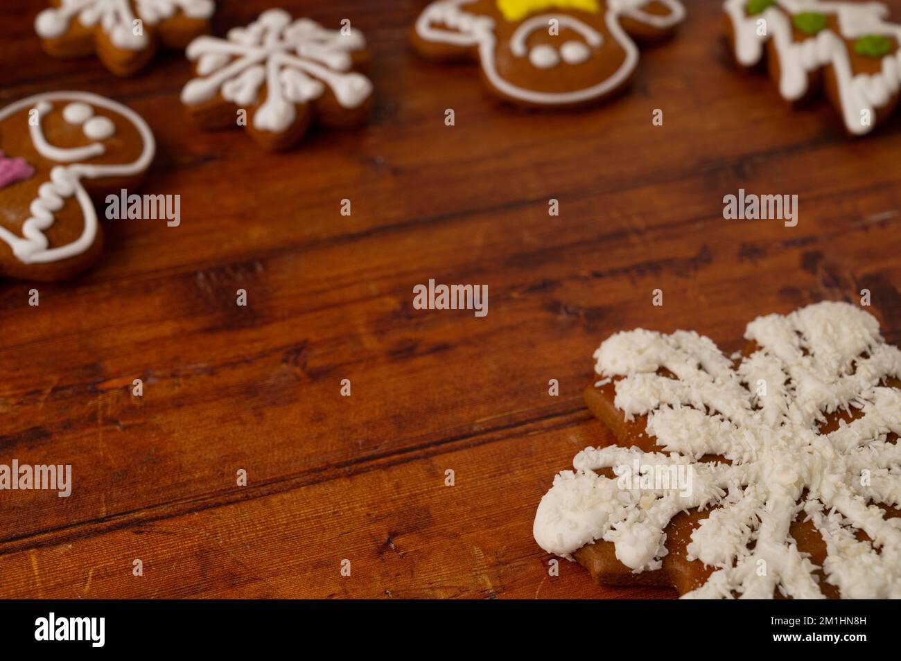 Close-up of a star-shaped gingerbread with coconut shards frosting on a ...