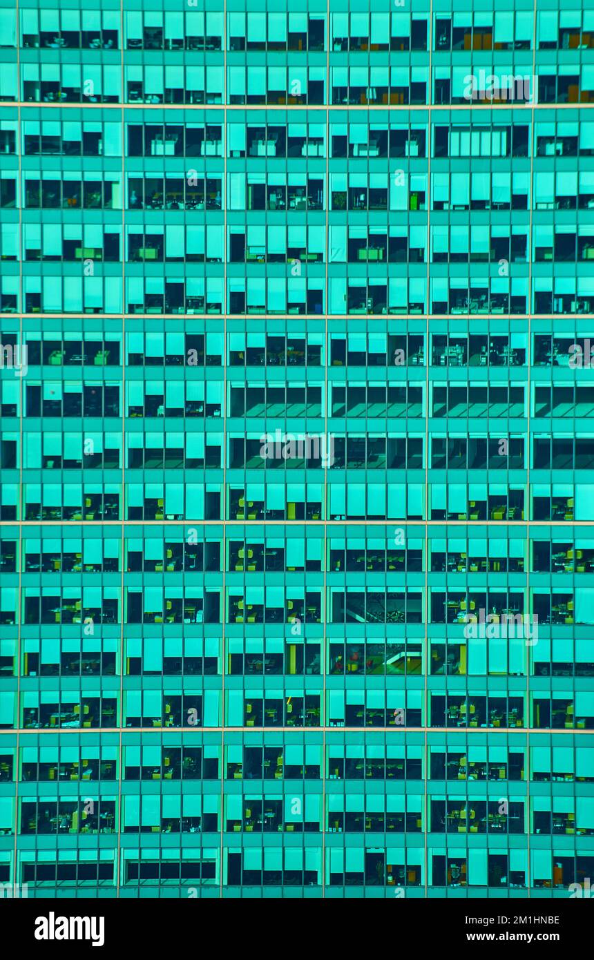 Wall of turquoise glass of New York City skyscraper office building ...