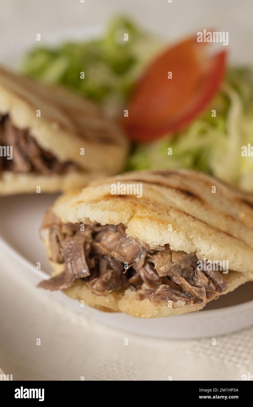 Close up Arepas, typical Venezuelan food, made with maize and filled ...