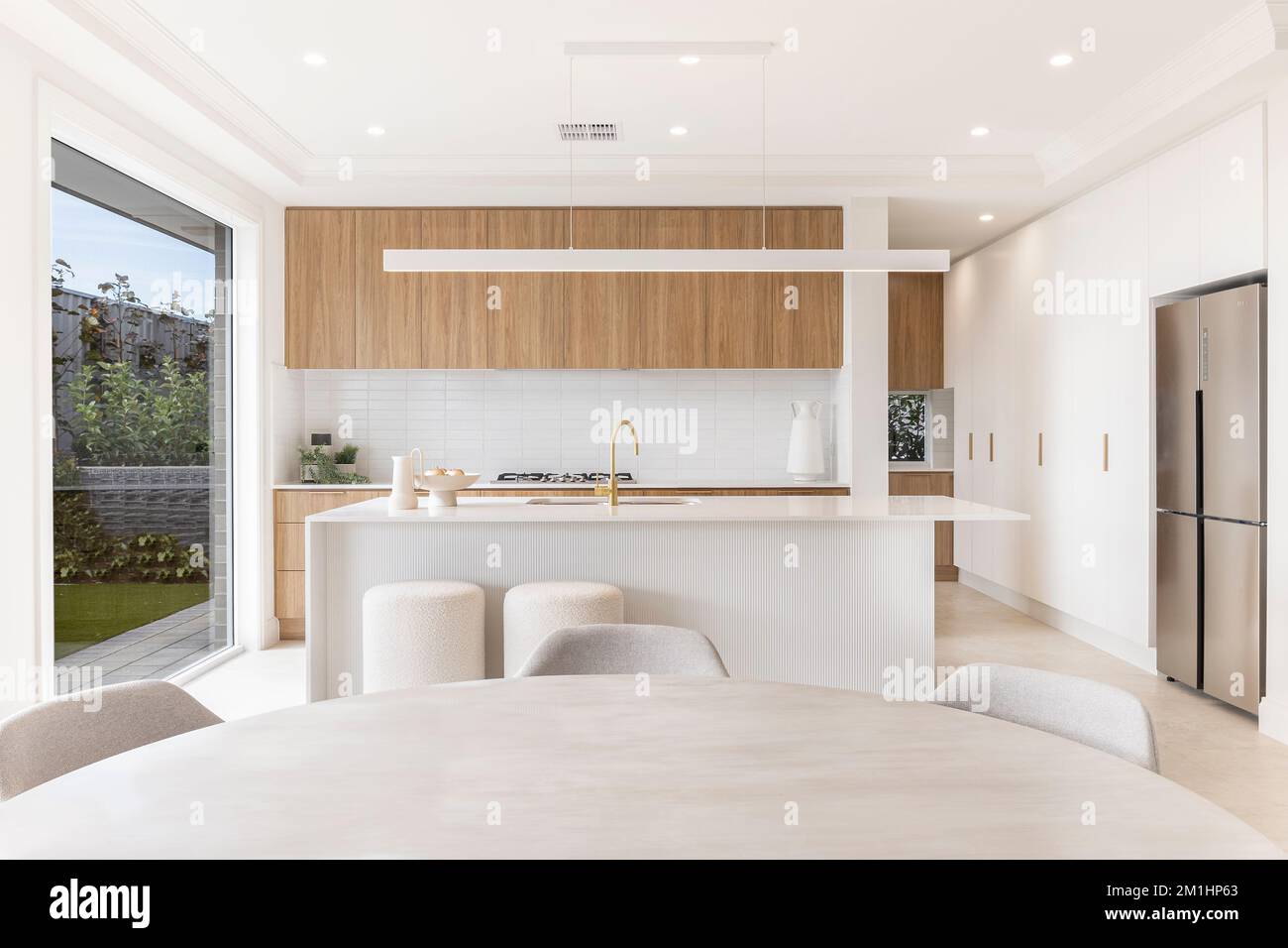 Front view modern white kitchen interior with wooden cupboards Stock ...