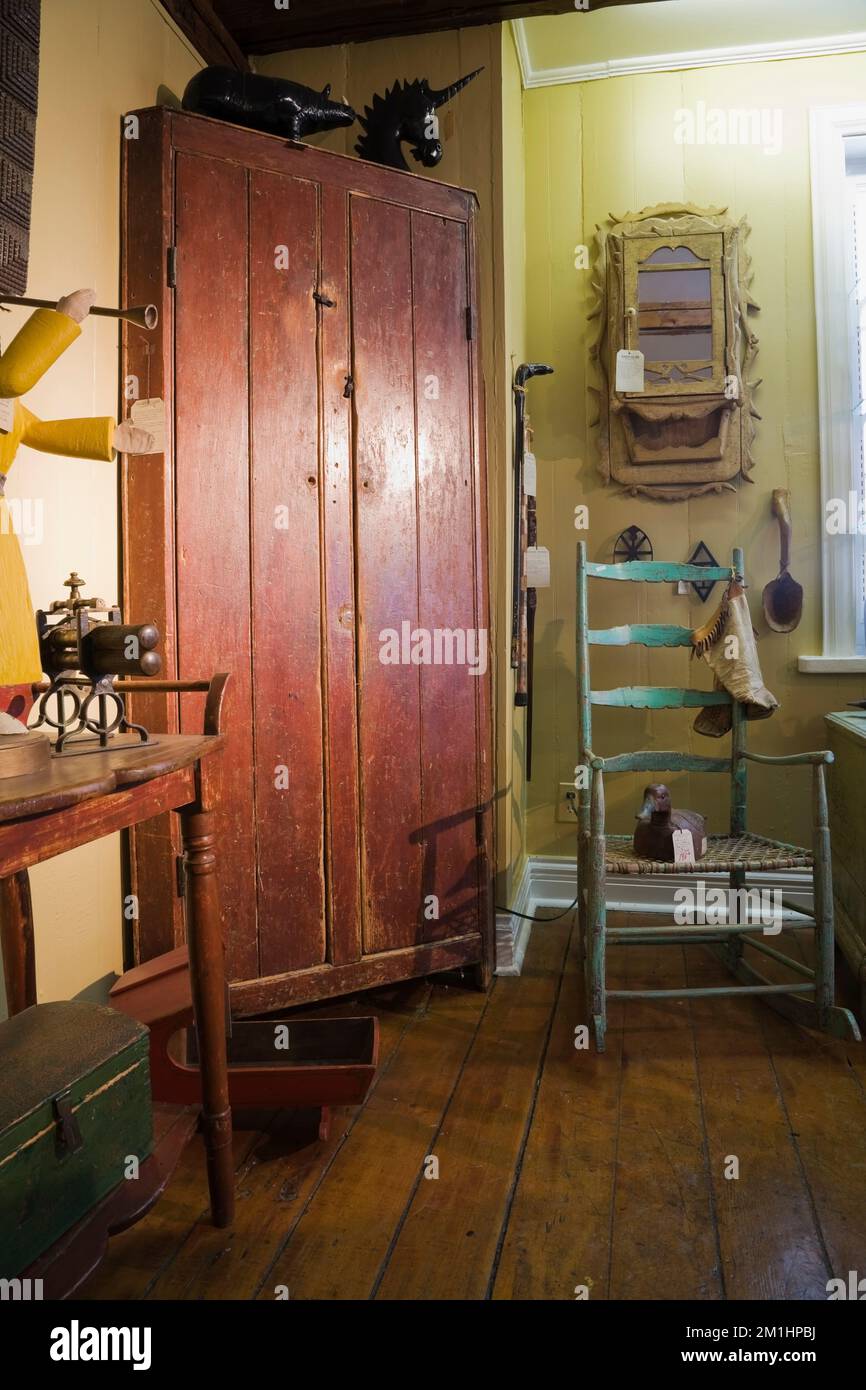 Antique brownish red wooden armoire and decorative objects and ...