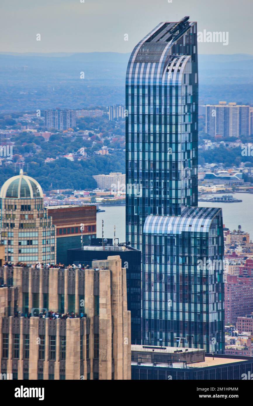 Vertical of New York City skyscraper detail from high up with curved ...