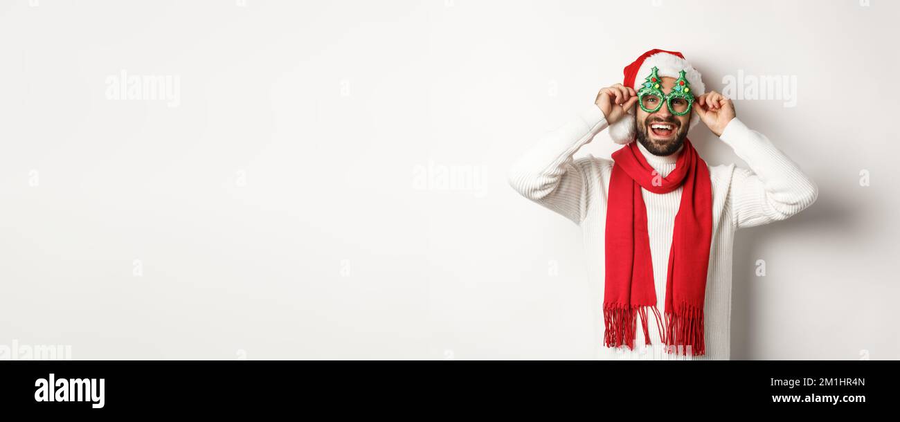 Christmas, New Year and celebration concept. Happy man laughing ...