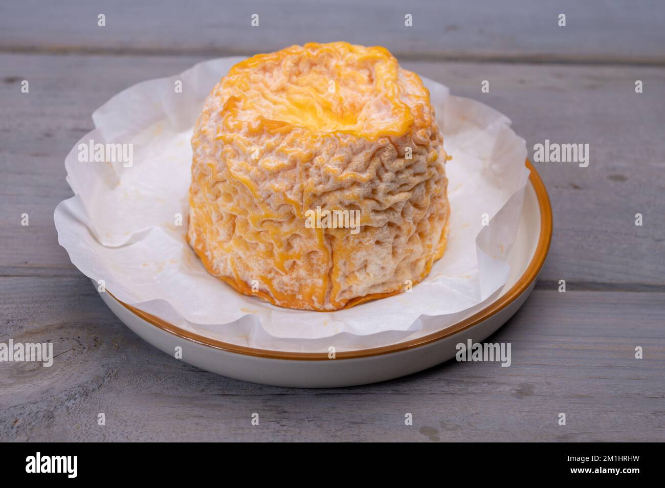 French Langres soft cows crumbly cheese with washed rind structure made ...