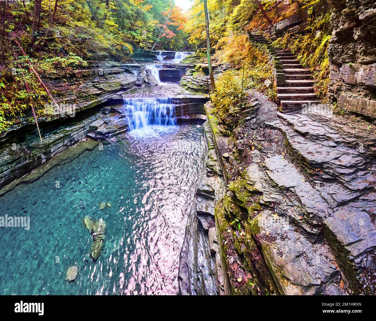 Beautiful turquoise waters in gorge of Upstate New York along stone ...
