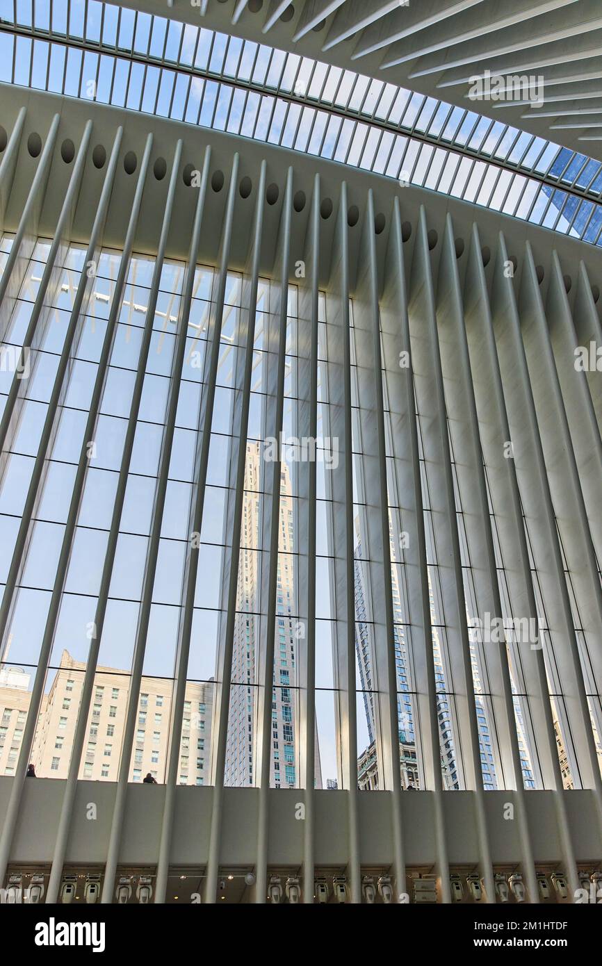 Ribs of clean white interior subway with window views of skyscrapers ...