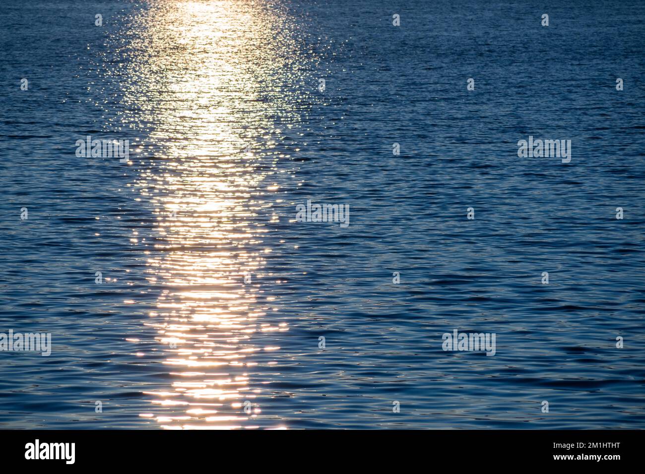 blue Water with waves on the surface at sunset golden hour Stock Photo ...