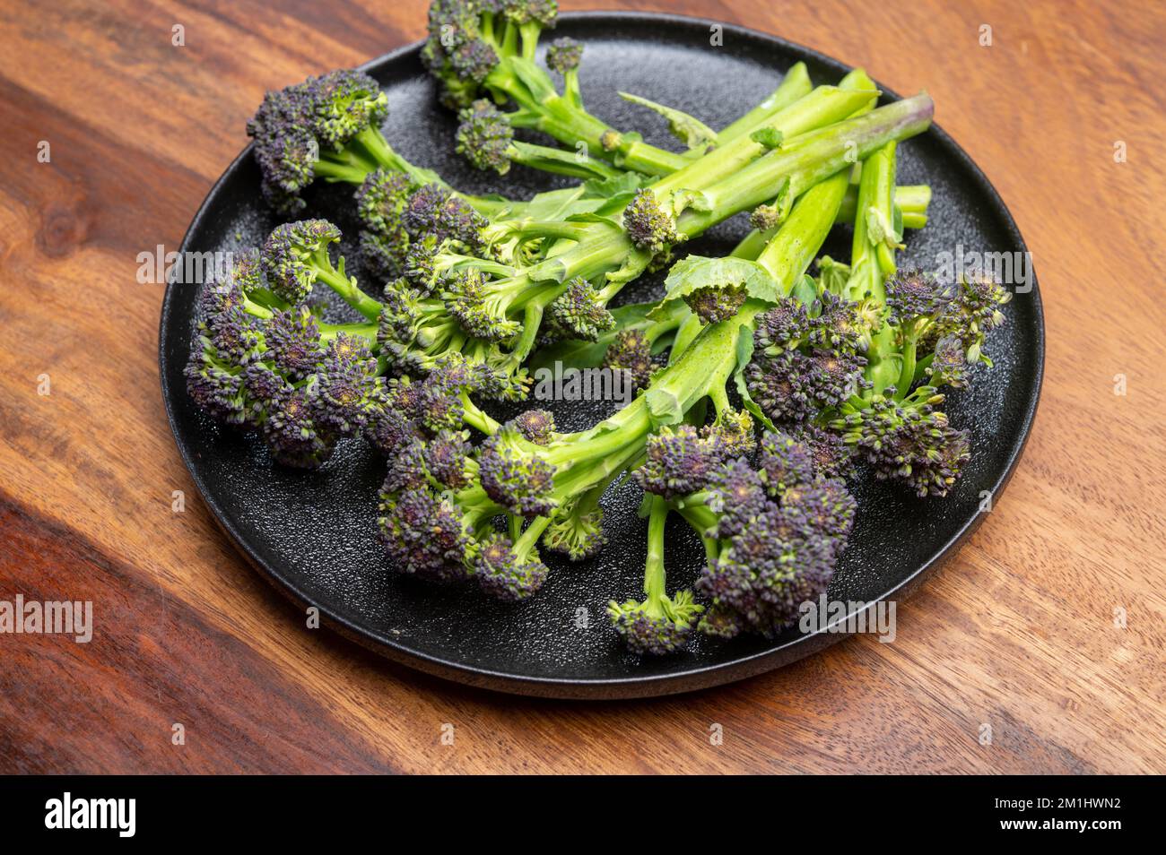 Dark green stems of fresh uncooked bimi asparagus broccoli vegetables ...