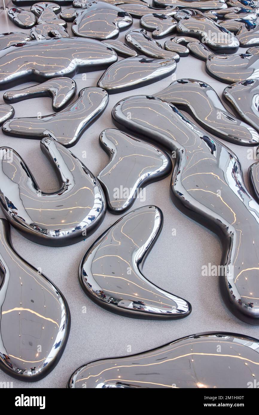 Abstract melted reflecting metal drops on floor Stock Photo - Alamy