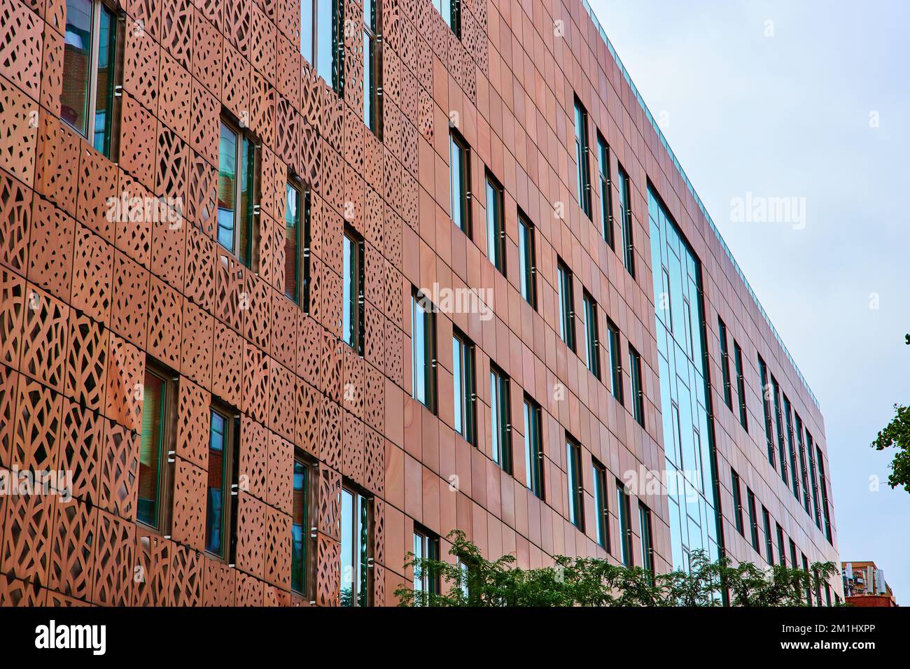 Artistic building exterior with metal cutouts and windows Stock Photo ...