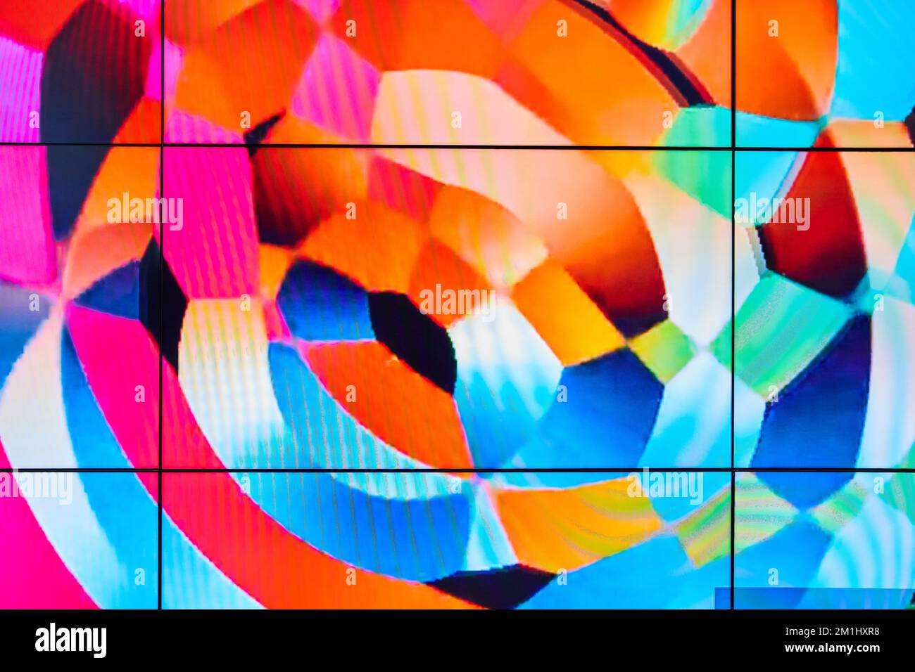 Huge LED panels with abstract swirls of color and light Stock Photo - Alamy