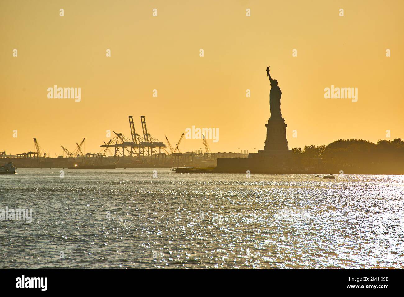 Beautiful Statue of Liberty in New York City with soft golden light and ...