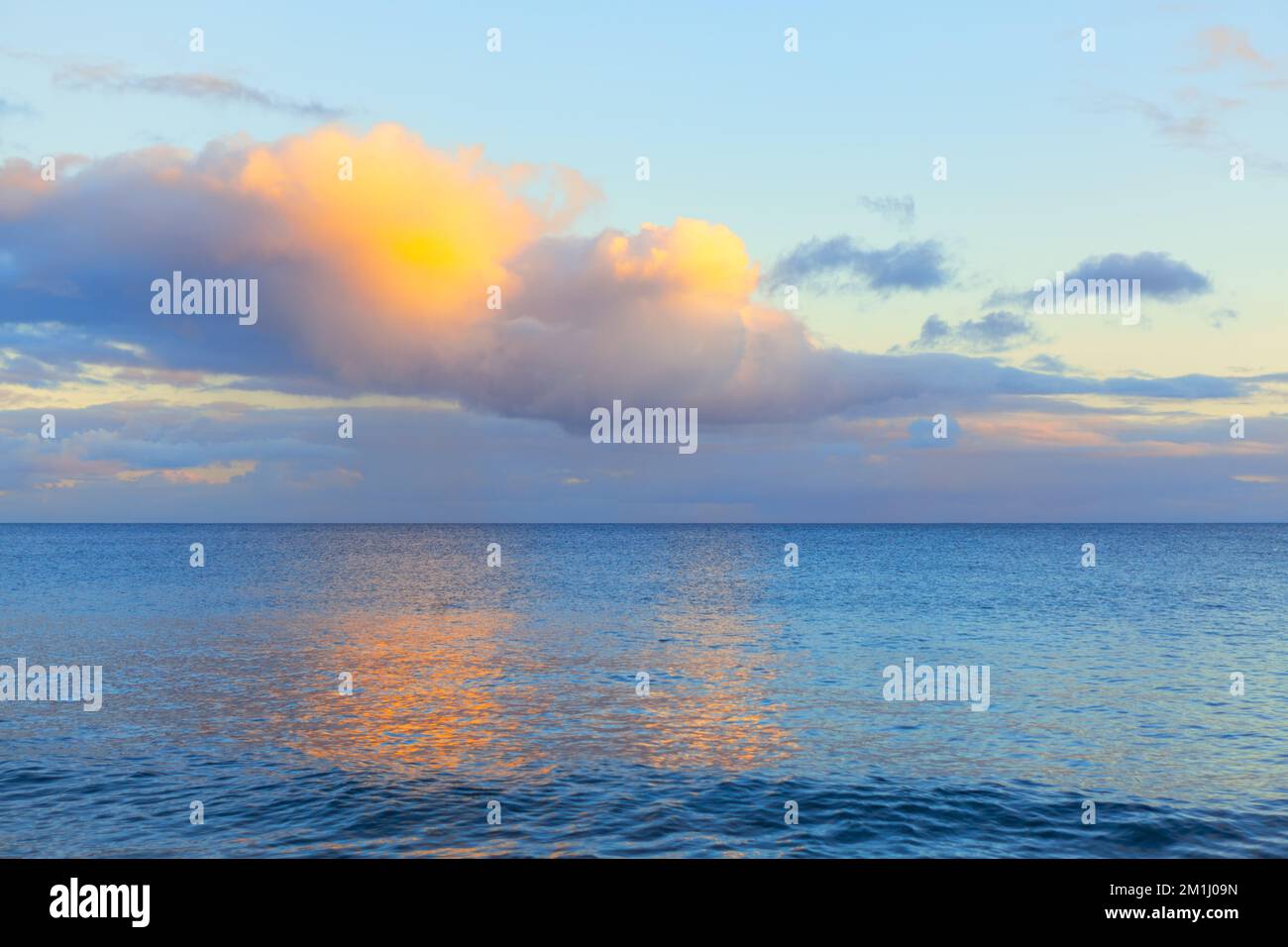 Colorful clouds over the ocean . Twilight reflection in the seawater ...