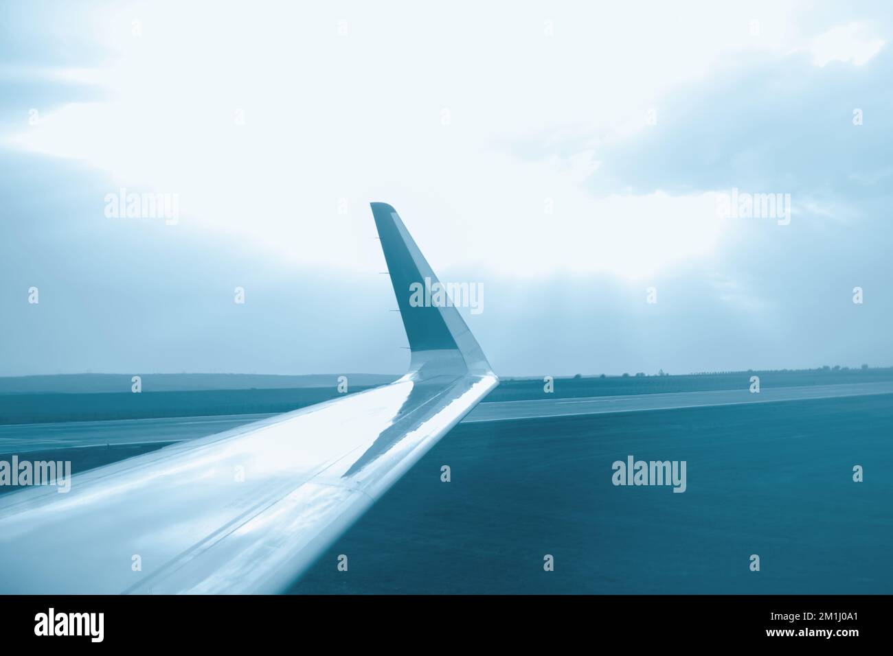 Airplane wing view during aircraft standing on the ground Stock Photo ...