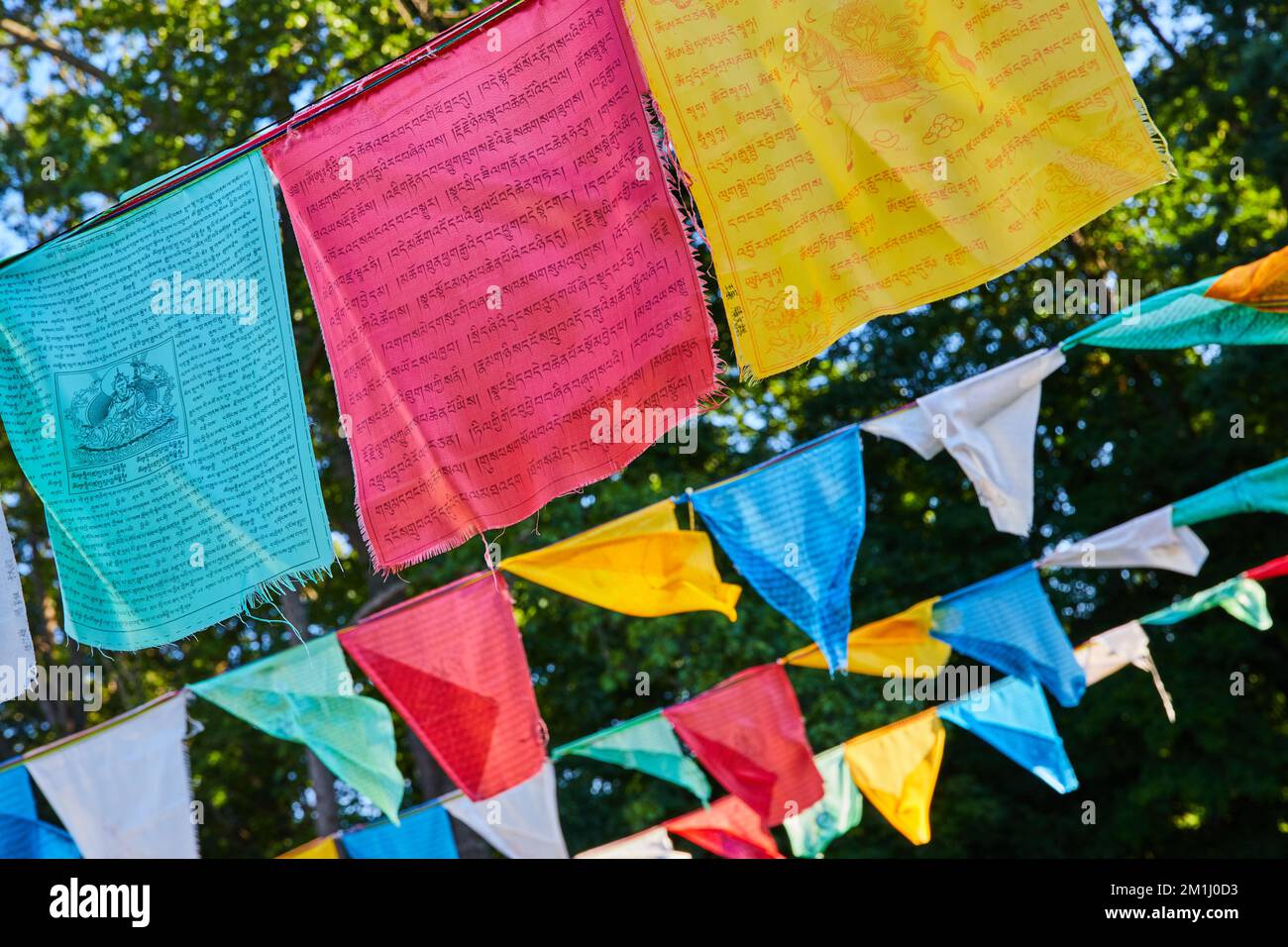 Shrine for Tibetan Mongolian Buddhist with colorful prayer flags Stock ...