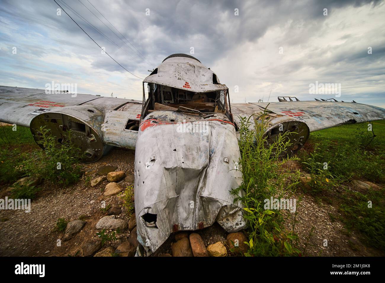 Front view of crashed airplane small in fields with overcast sky Stock ...