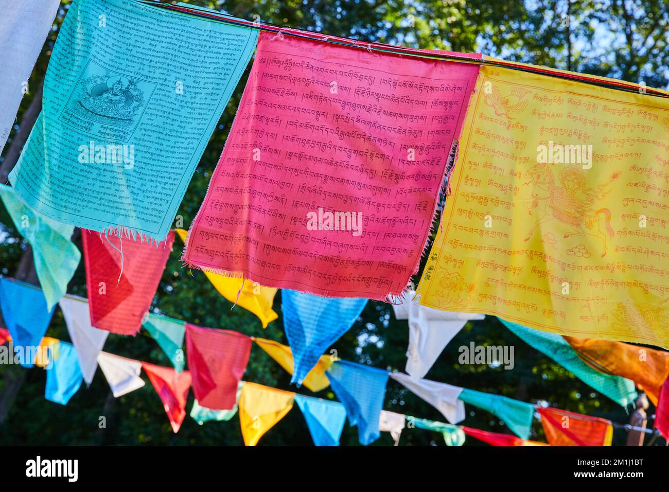 Rows of vibrant prayer flags for Tibetan Mongolian Buddhist shrine ...