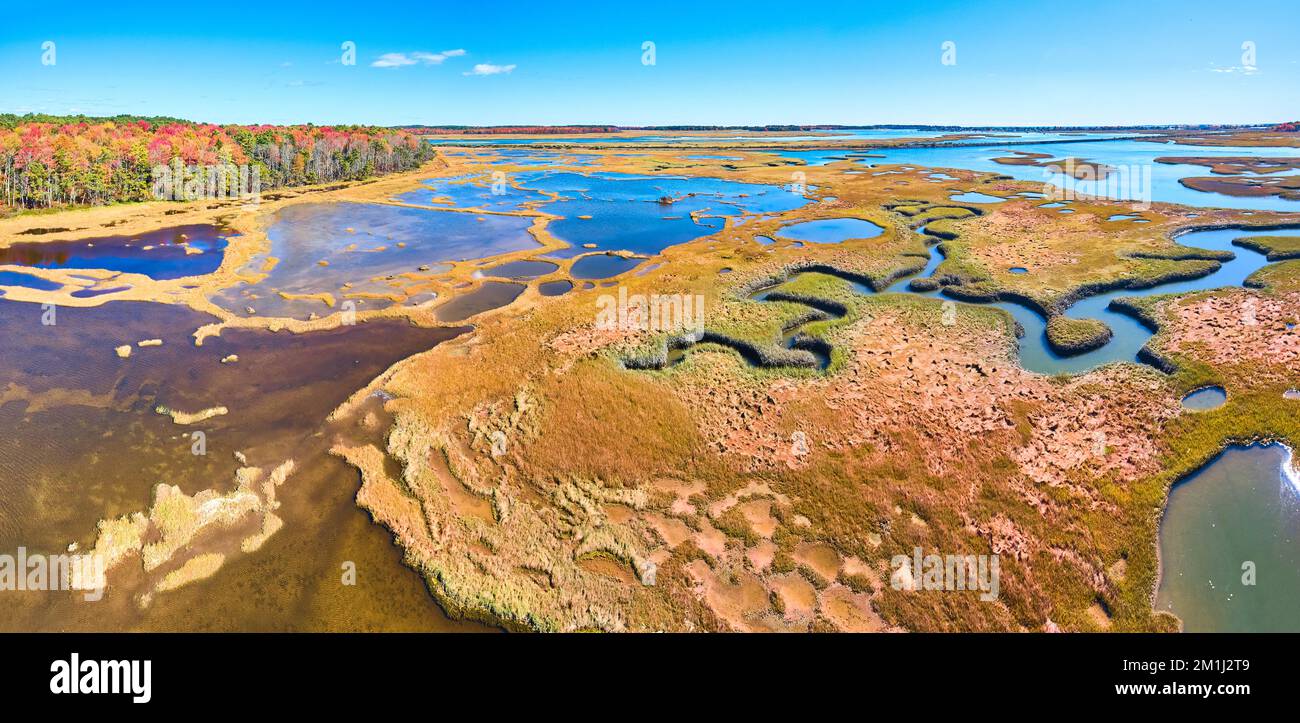 Fall forest surround marshes of Maine with winding creeks Stock Photo ...
