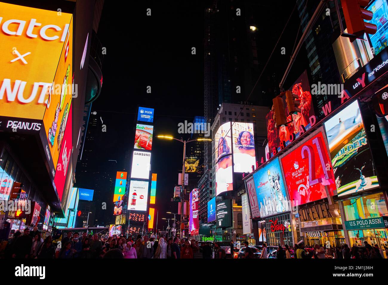 Iconic New York City Times Square at night with advertisements and ...