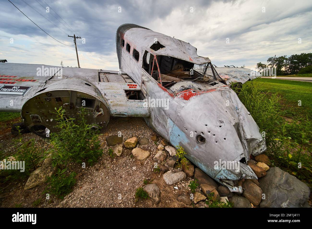 Old abandoned crashed plane in fields on cloudy day Stock Photo - Alamy