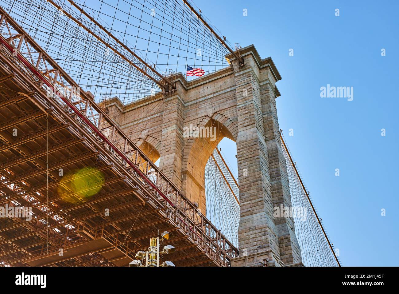 Stunning Brooklyn Bridge in New York City from below in golden light ...