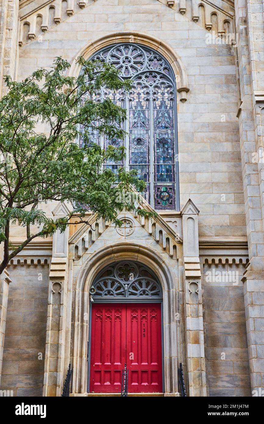 Front of Christian Church with vibrant red doors and stained glass ...
