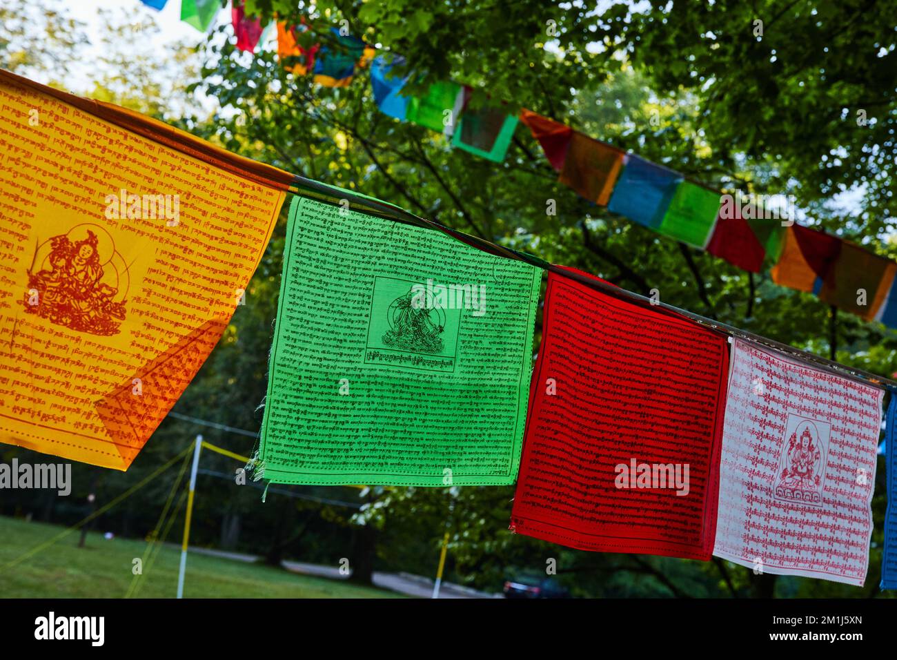Ropes covered in dozens of Tibetan Mongolian Buddhist prayer flags ...