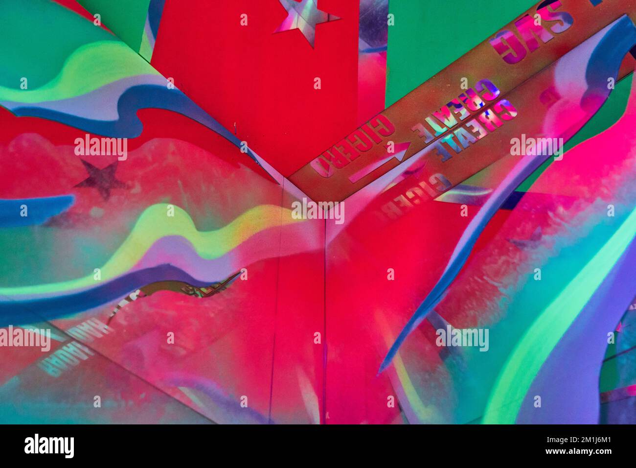 Intersection of abstract art in corner of room with colorful glowing ...