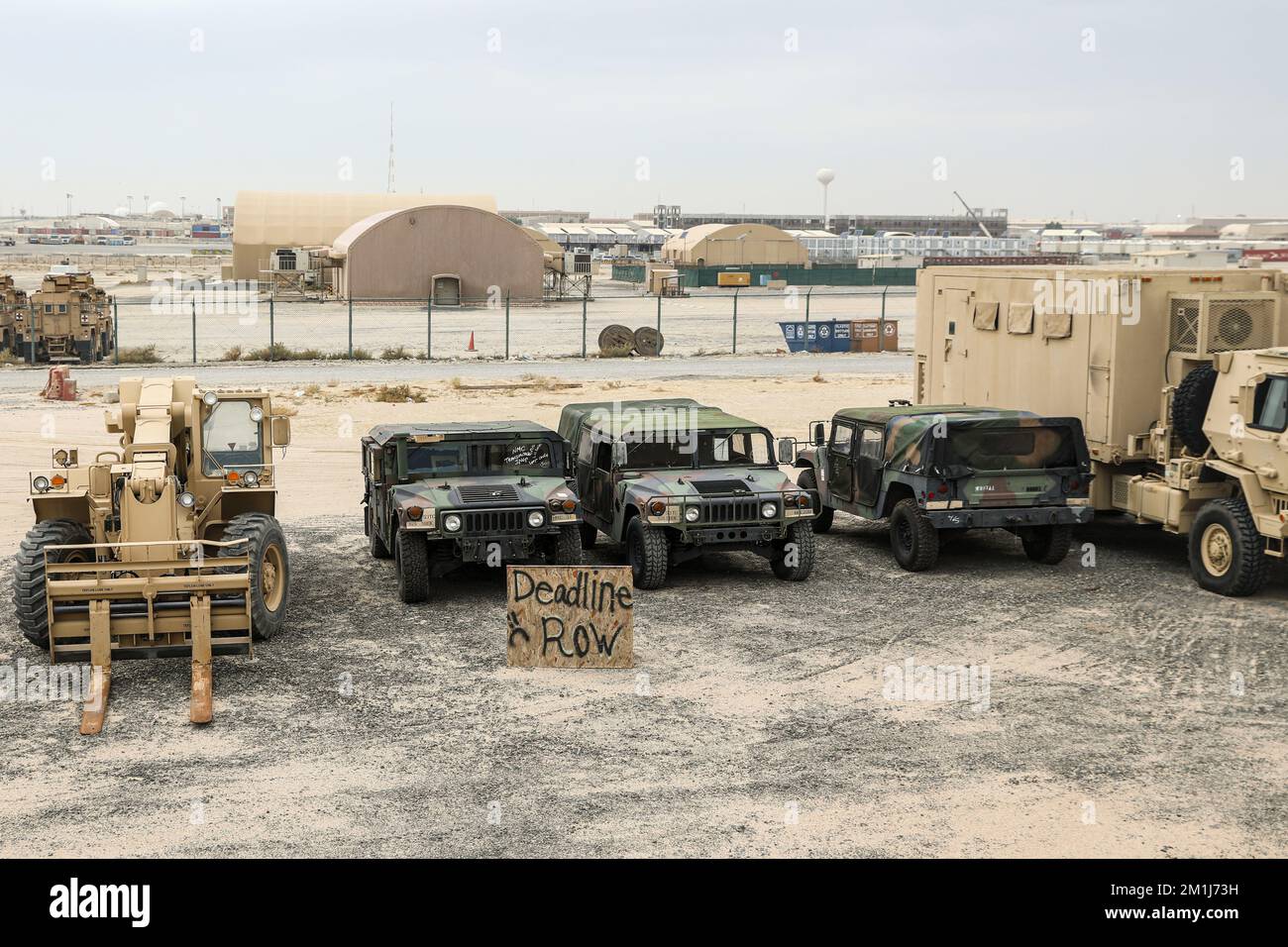 Vehicles that belong to the 369th Sustainment Brigade rest at a section ...