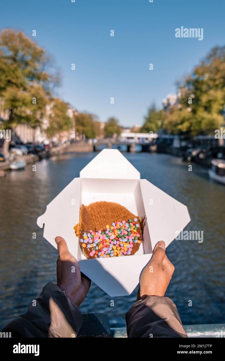 Stroopwafel in Amsterdam is typical Dutch food two circular pieces of ...
