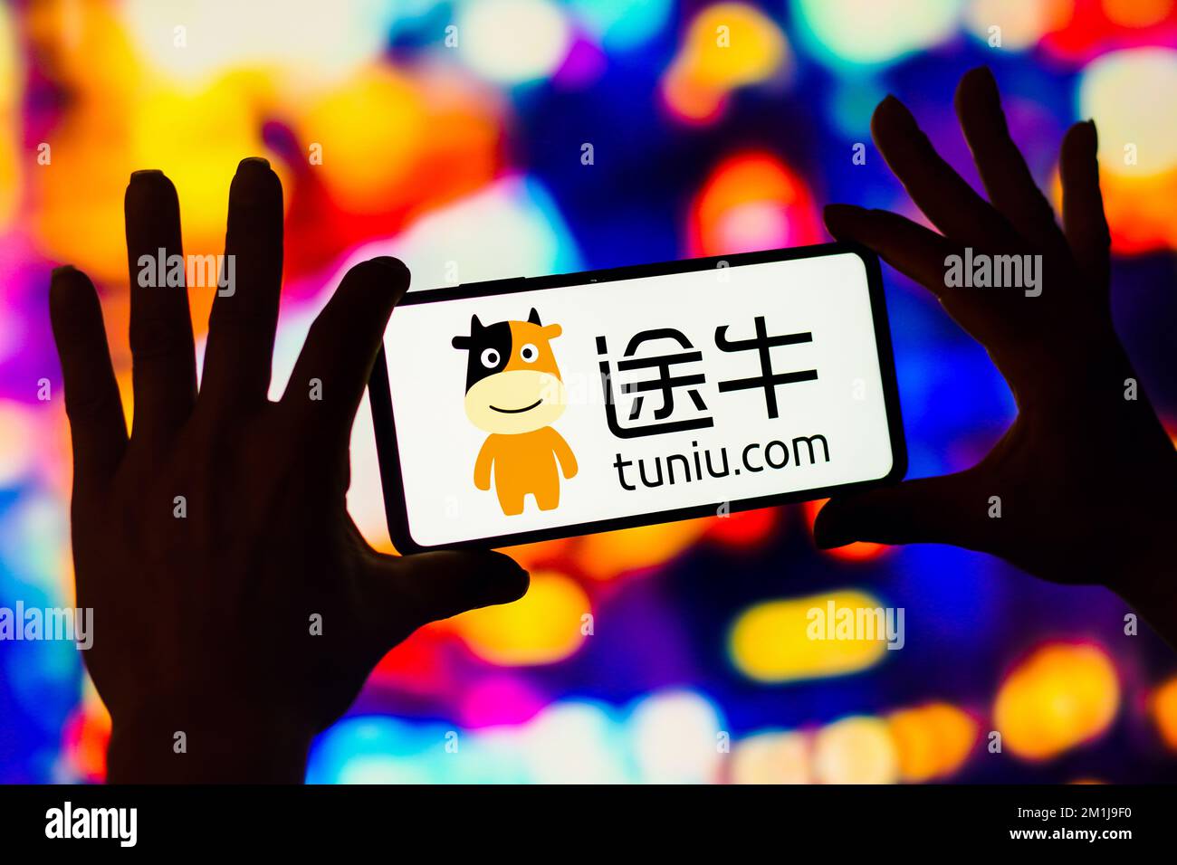 In this photo illustration, the Tuniu Corporation logo is displayed on ...