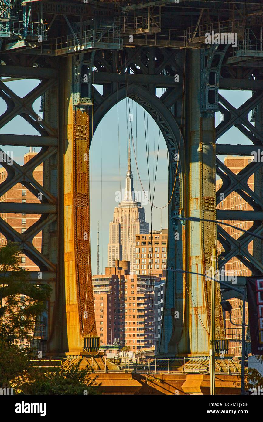 View of Empire State Building through underside of Manhattan Bridge in ...