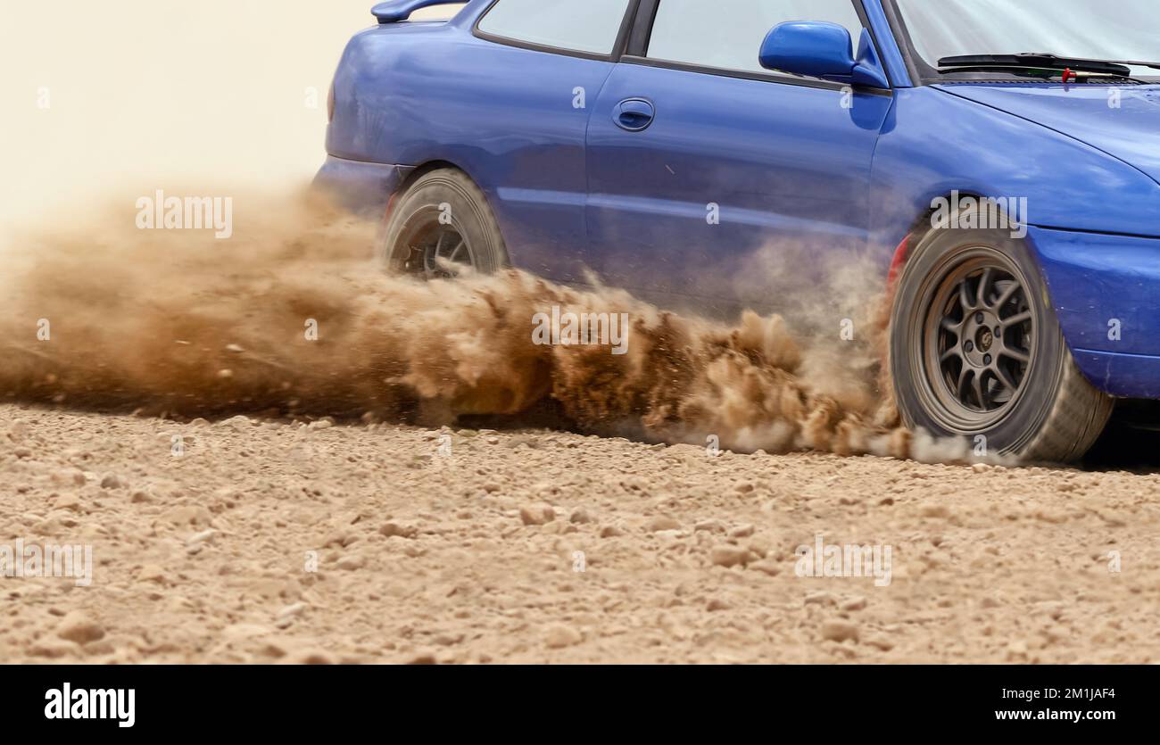 Rally race car drifting on dirt track Stock Photo - Alamy