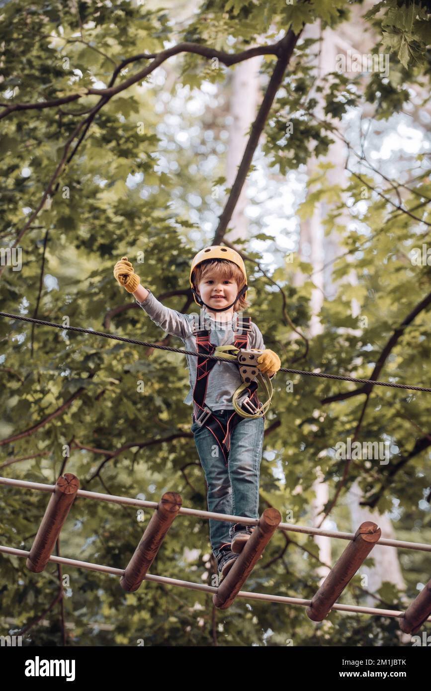Toddler age. Balance beam and rope bridges. Carefree childhood. Kids ...