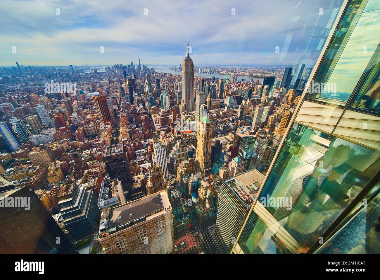 High up skyscraper window edge overlooking all of Manhattan in New York ...