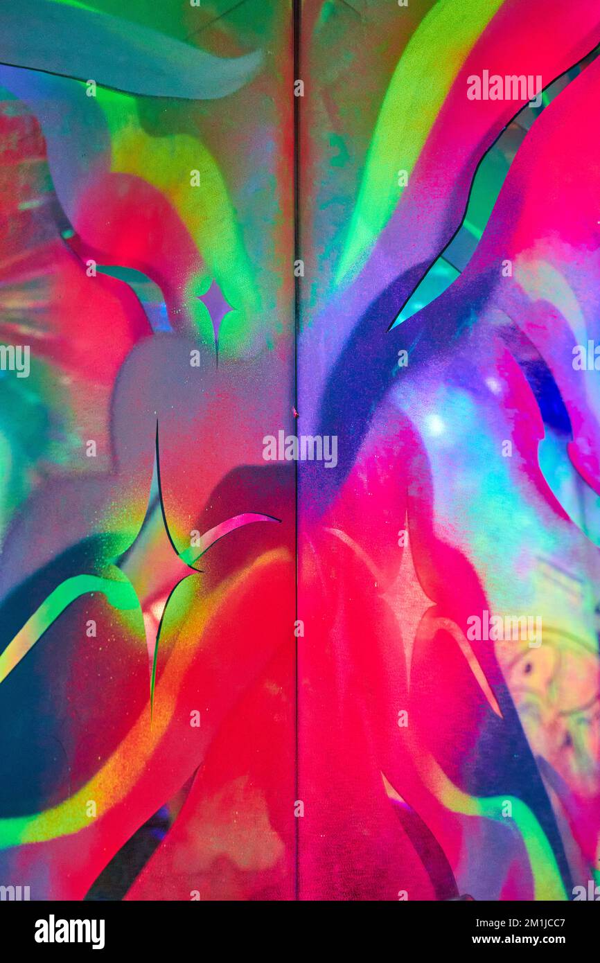 Corner of room with abstract colorful glowing artwork Stock Photo - Alamy