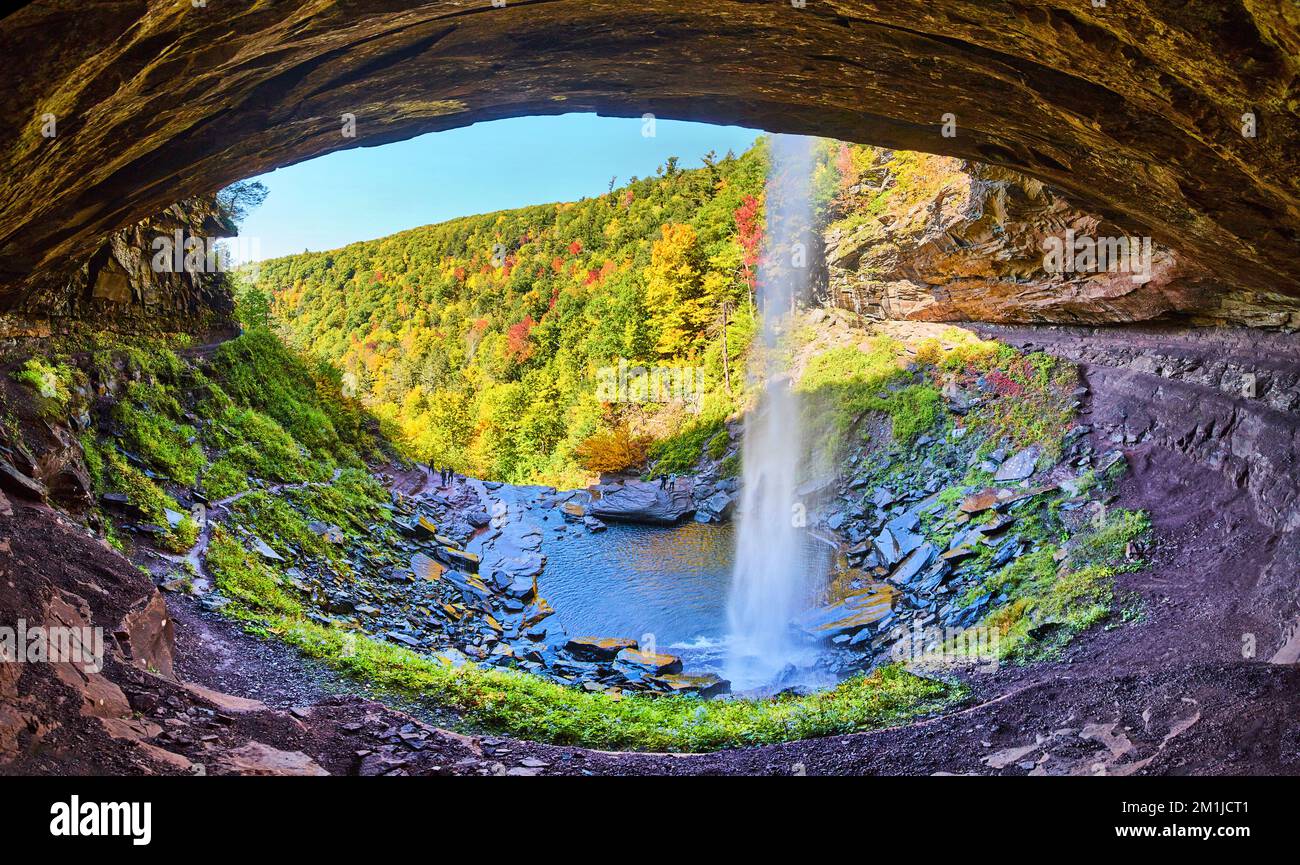 Panoramic view behind waterfall in rocky cavern cliffs with fall ...