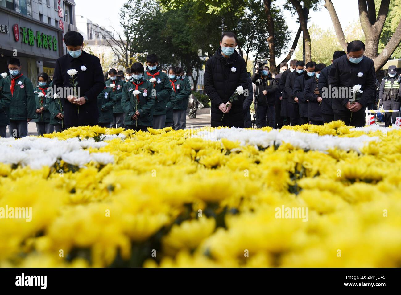 NANJING, CHINA - DECEMBER 13, 2022 - People pay tribute to the victims ...