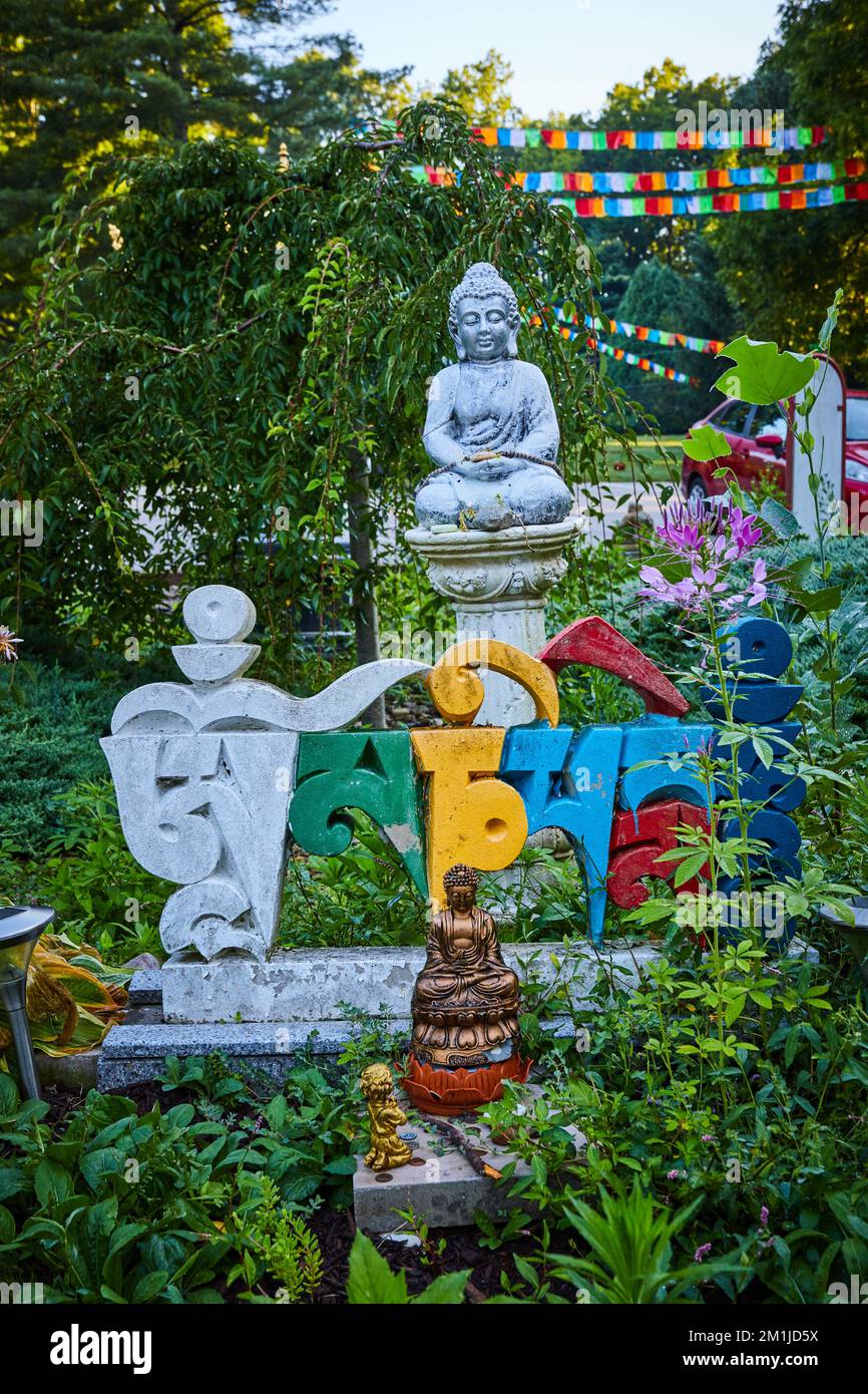 Foreign colorful letters and Buddha statues in prayer and meditation ...
